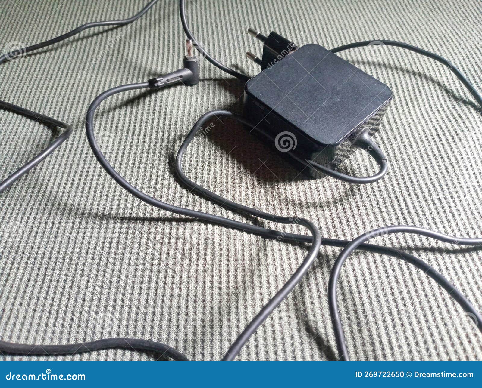 Laptop Charger with Its Messy Cable on a Structured Surface Stock Photo ...