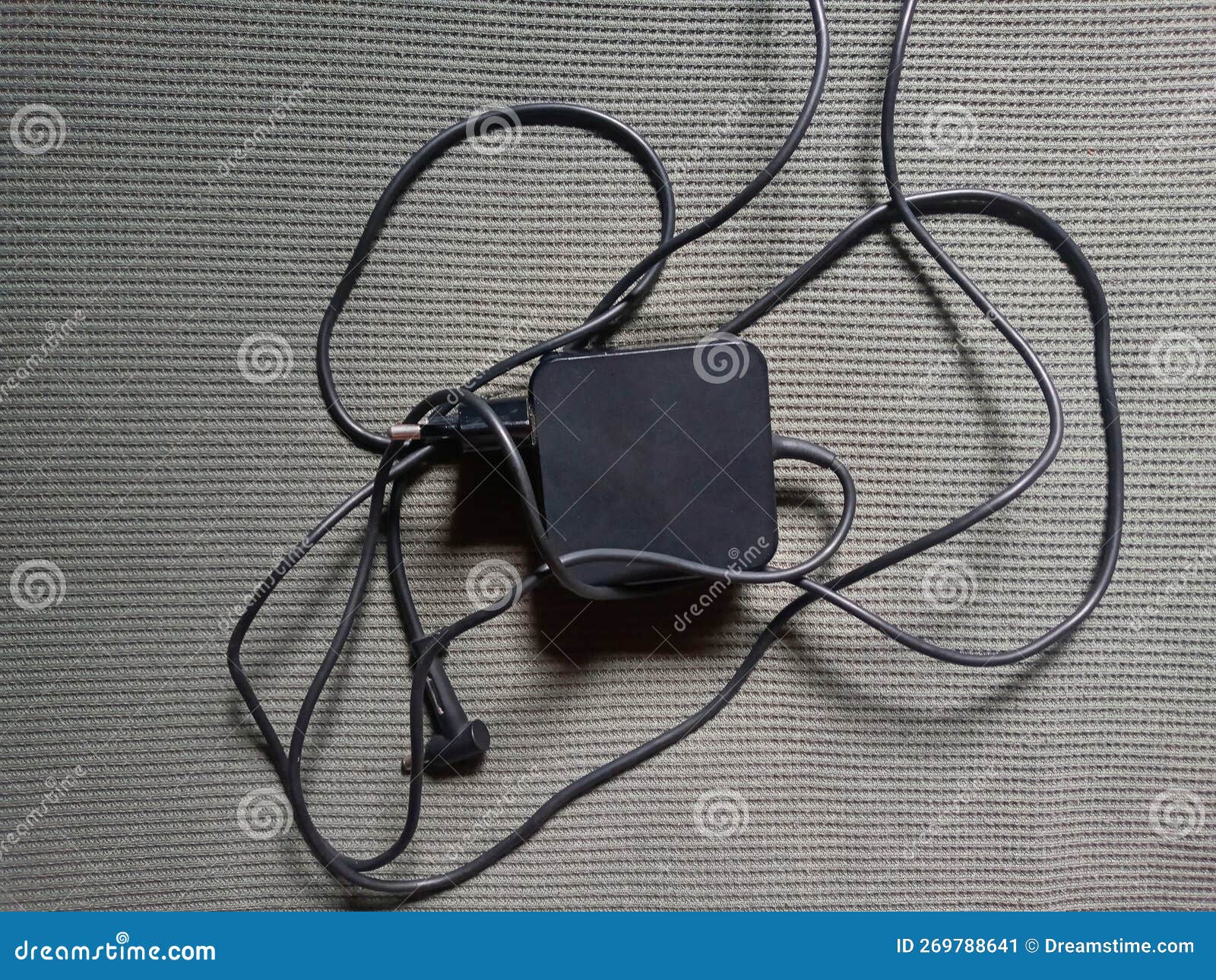 Laptop Charger with Its Messy Cable on a Structured Surface Stock Image ...