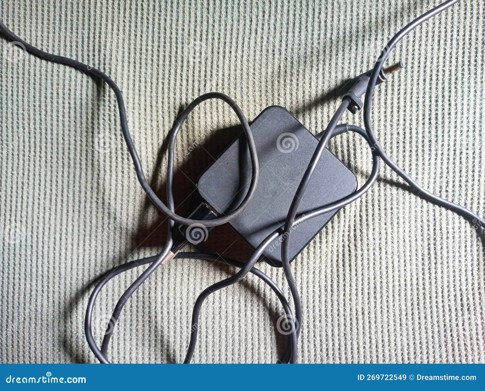 Laptop Charger with Its Messy Cable on a Structured Surface Stock Image ...