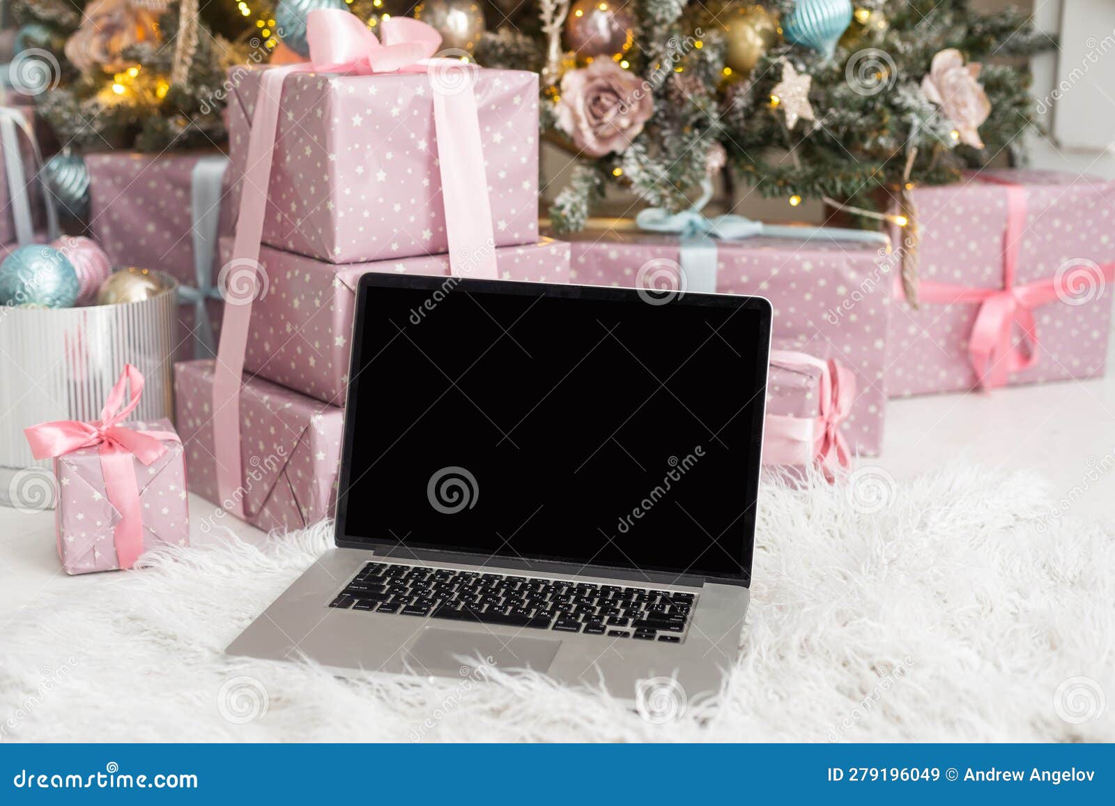 Laptop and Christmas Tree in the Background Stock Image - Image of ...