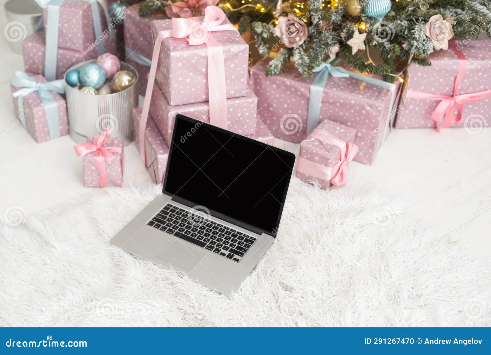 Laptop and Christmas Tree in the Background Stock Photo - Image of ...