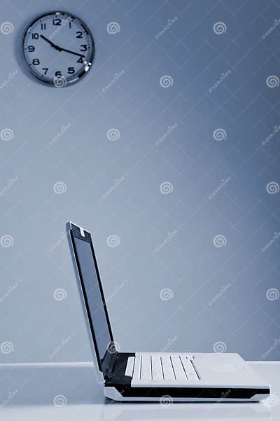 Laptop and clock stock photo. Image of white, desk, clock - 8855452