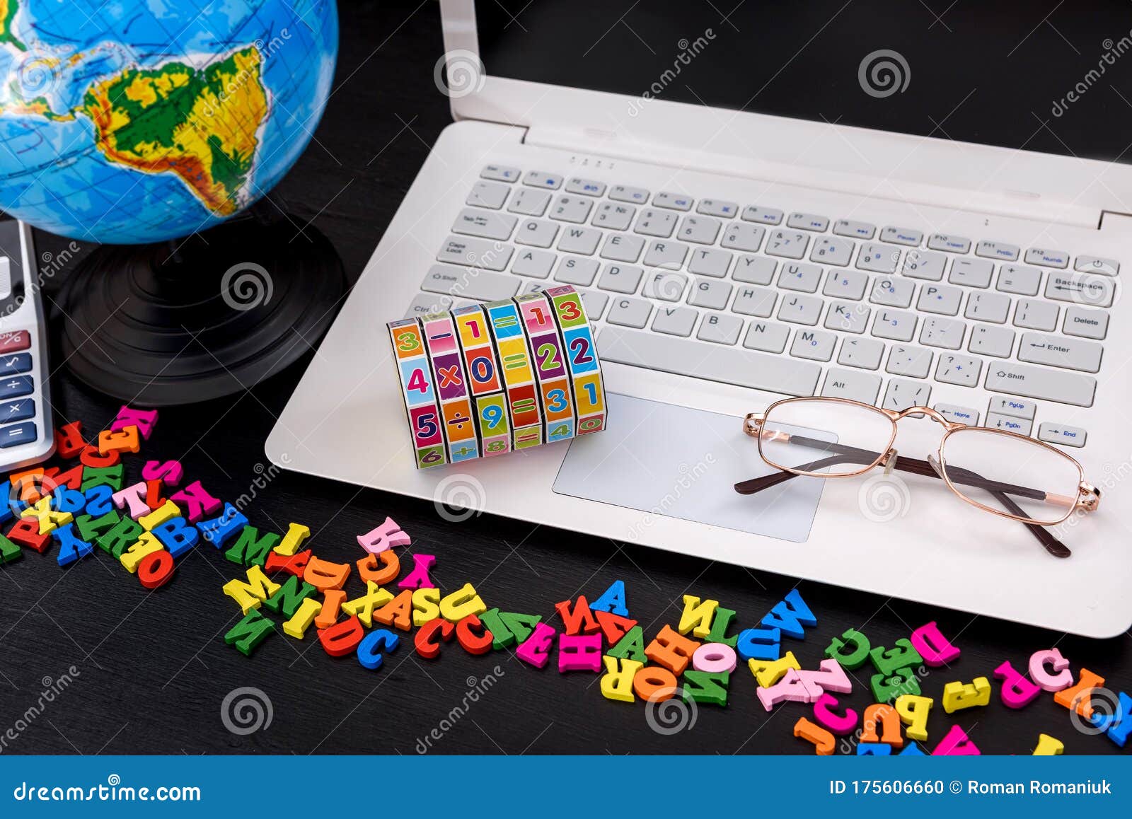 Laptop with Colorful Alphabet and Globe on Table Stock Photo - Image of ...