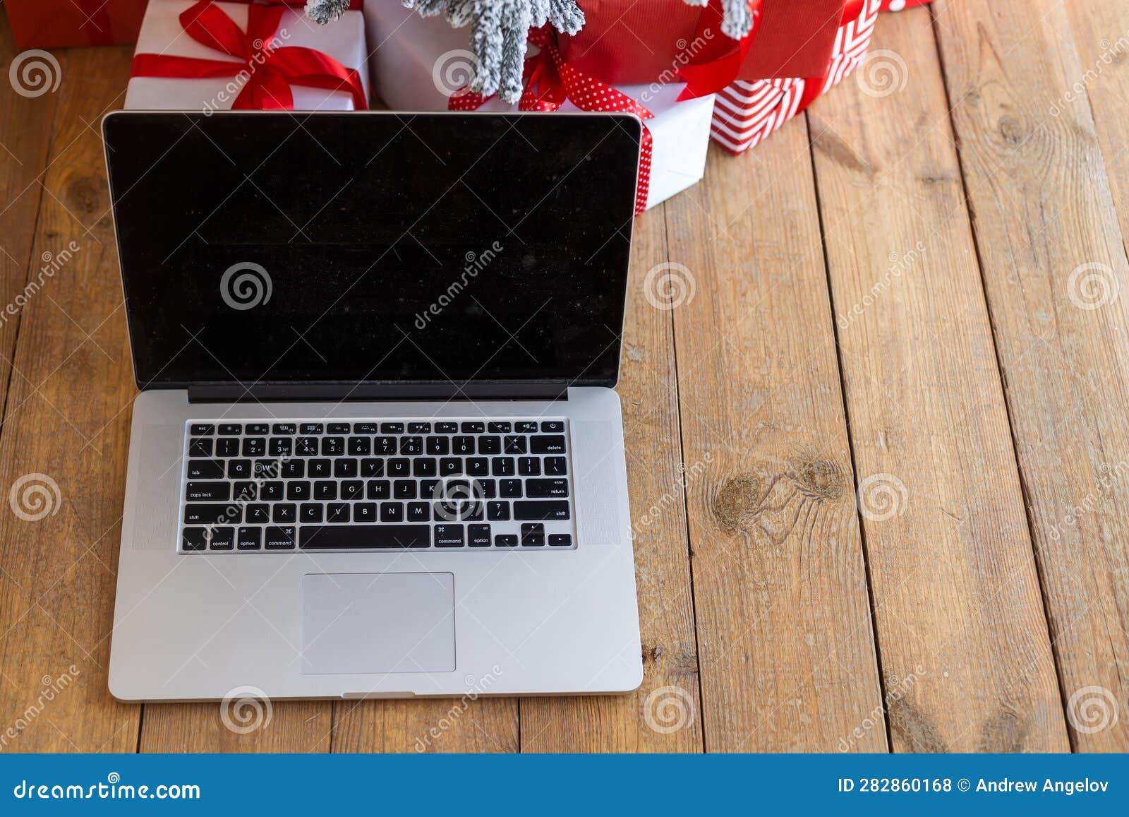 Laptop Computer Against Blurred Christmas Lights Background Editorial ...