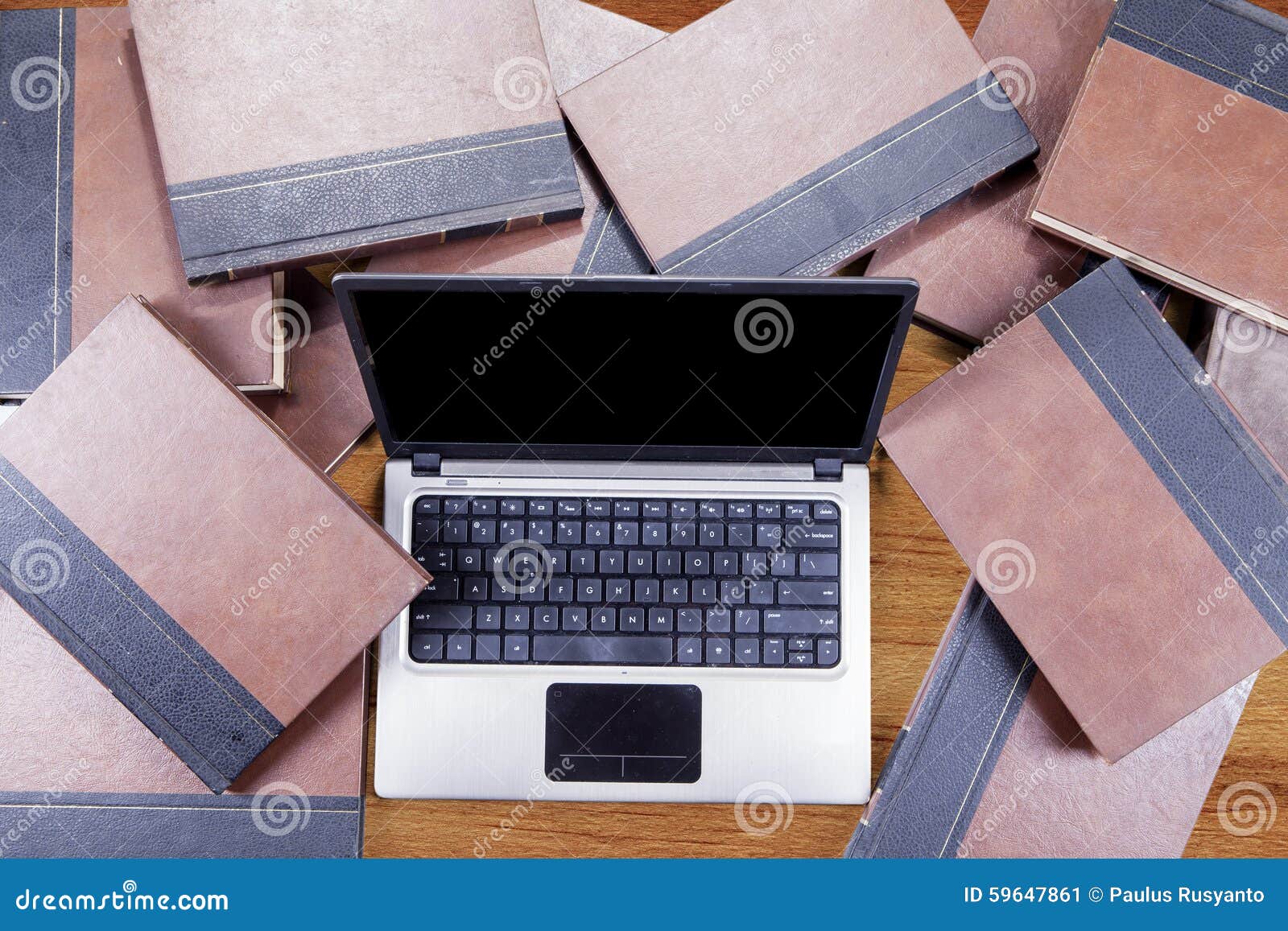 Laptop computer with books stock image. Image of internet - 59647861