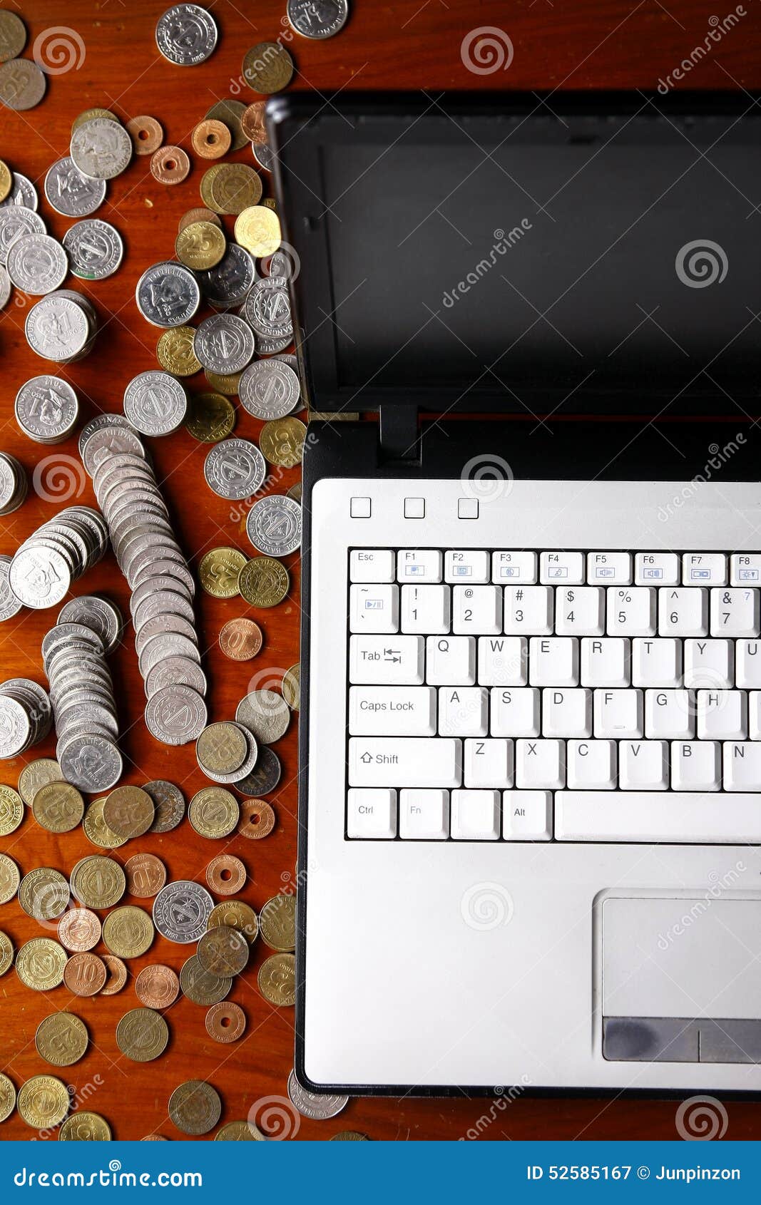 Laptop computer and coins stock image. Image of cash - 52585167