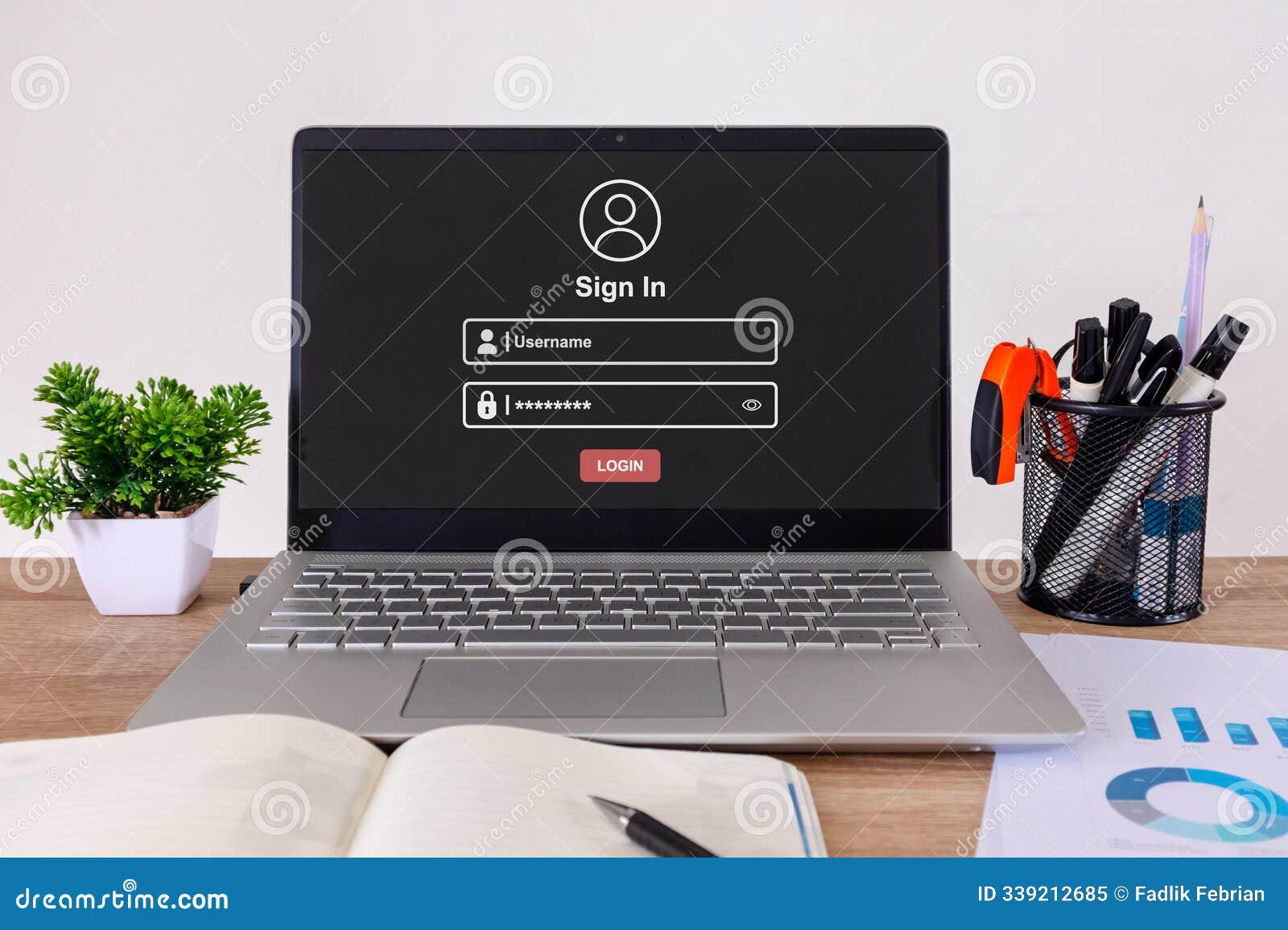 A Laptop Computer on the Desk with a Login Page on the Screen Stock ...