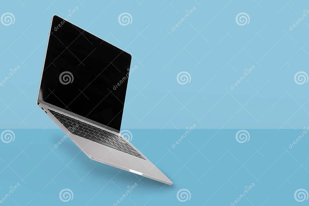 Laptop Computer with Empty Screen while Levitating in the Air on a Blue ...