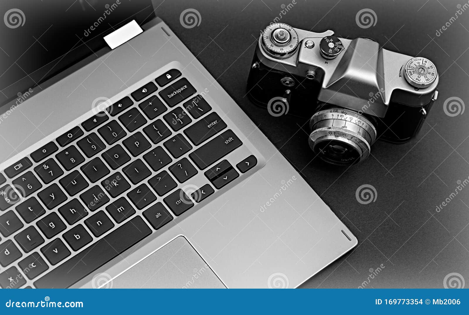 Laptop Computer and Film Camera on the Table Stock Photo - Image of ...