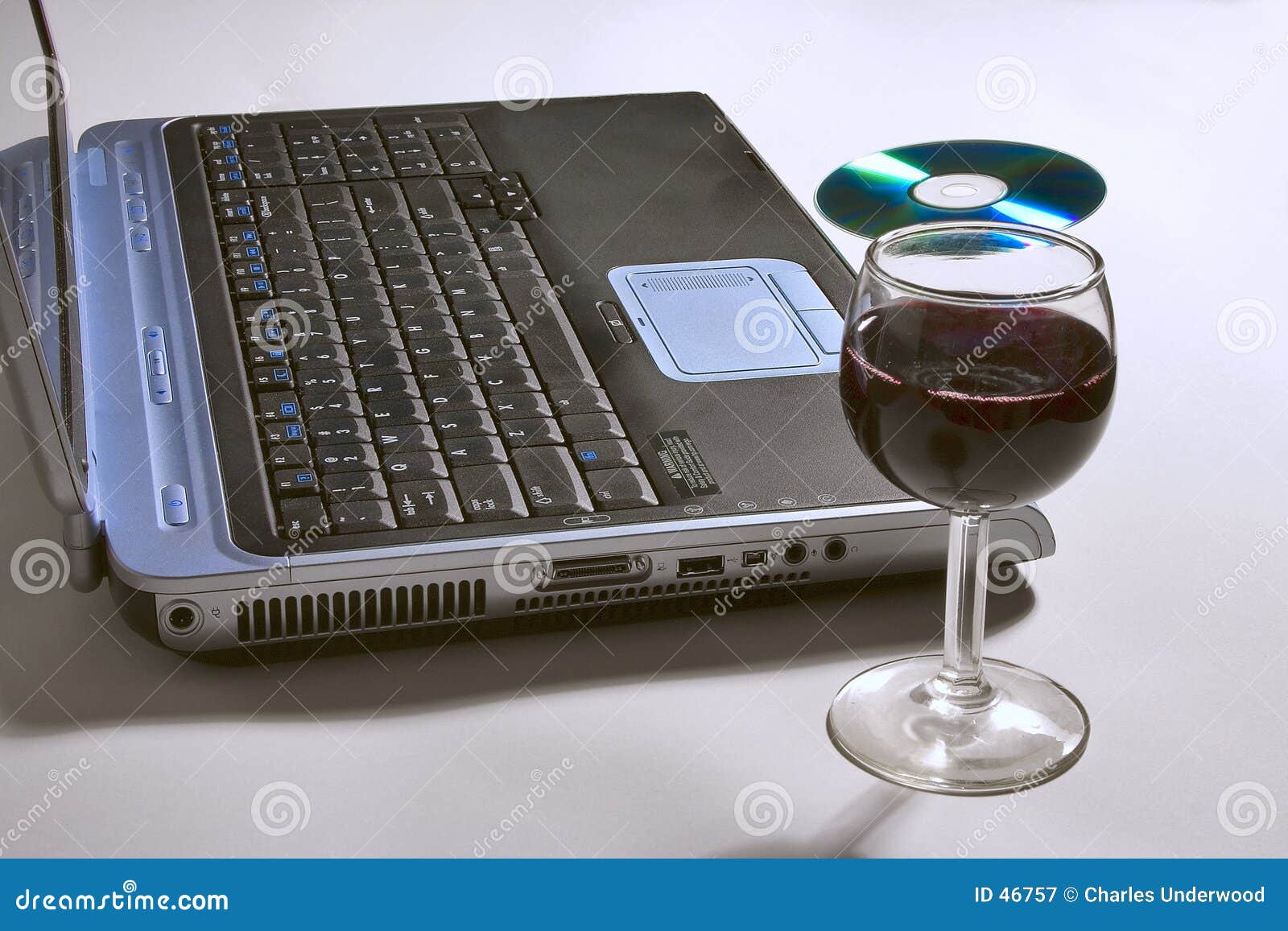 Laptop Computer with a Glass of Wine and CD. Stock Image - Image of ...