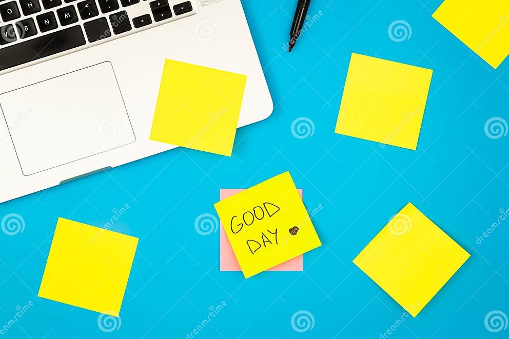 Laptop Computer with Many Sticky Notes on a Blue Background, Flat Lay ...