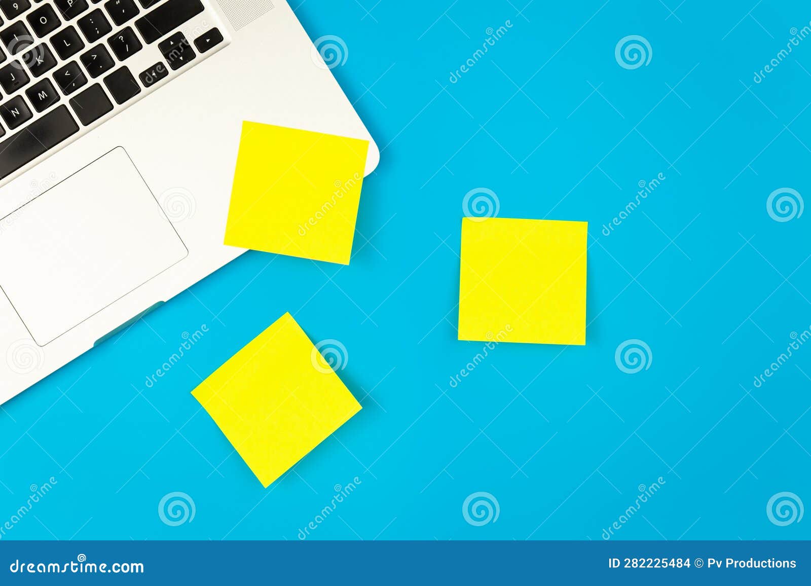 Laptop Computer with Many Sticky Notes on a Blue Background, Flat Lay ...