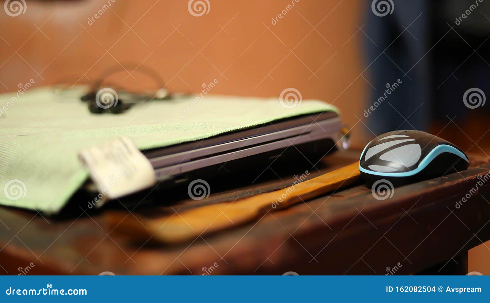 Laptop Computer with Mouse and Ear Phone on Work Table Front View Stock ...