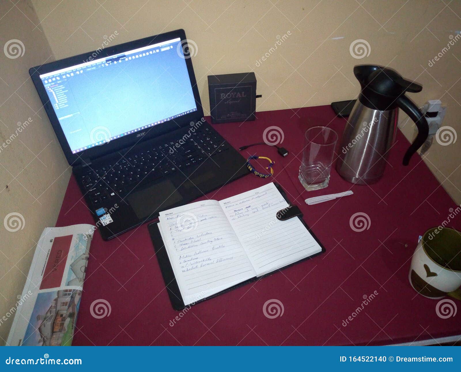 Laptop Computer with Notebook and Drink and Perfume and Remote ...