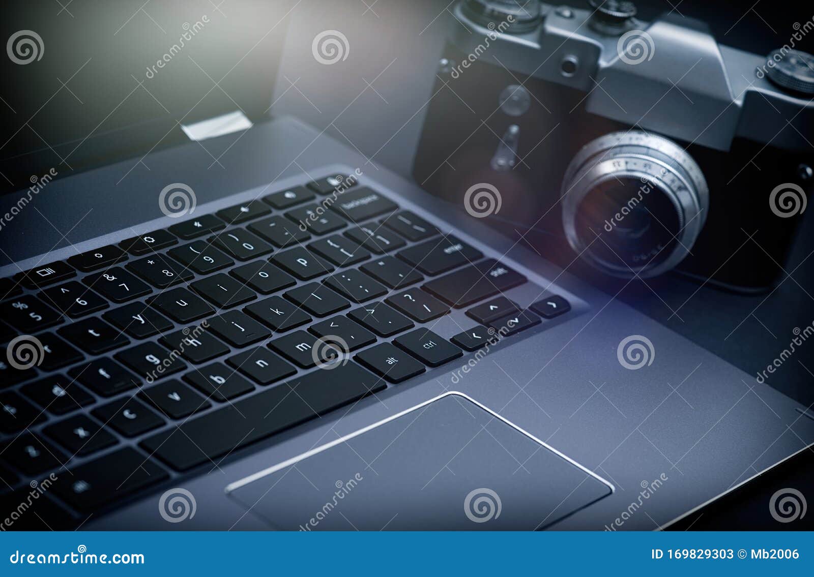 Laptop Computer and Film Camera on the Table Stock Image - Image of ...