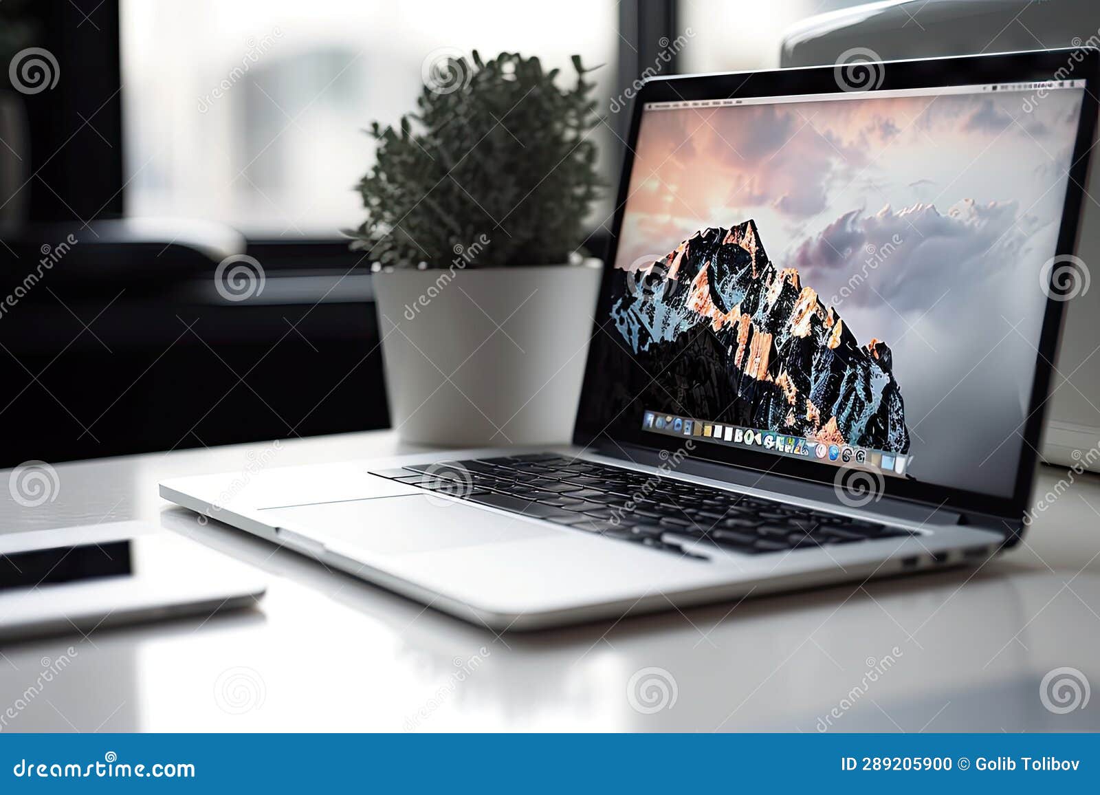A Laptop Computer Sitting on Top of a Desk Stock Photo - Image of ...