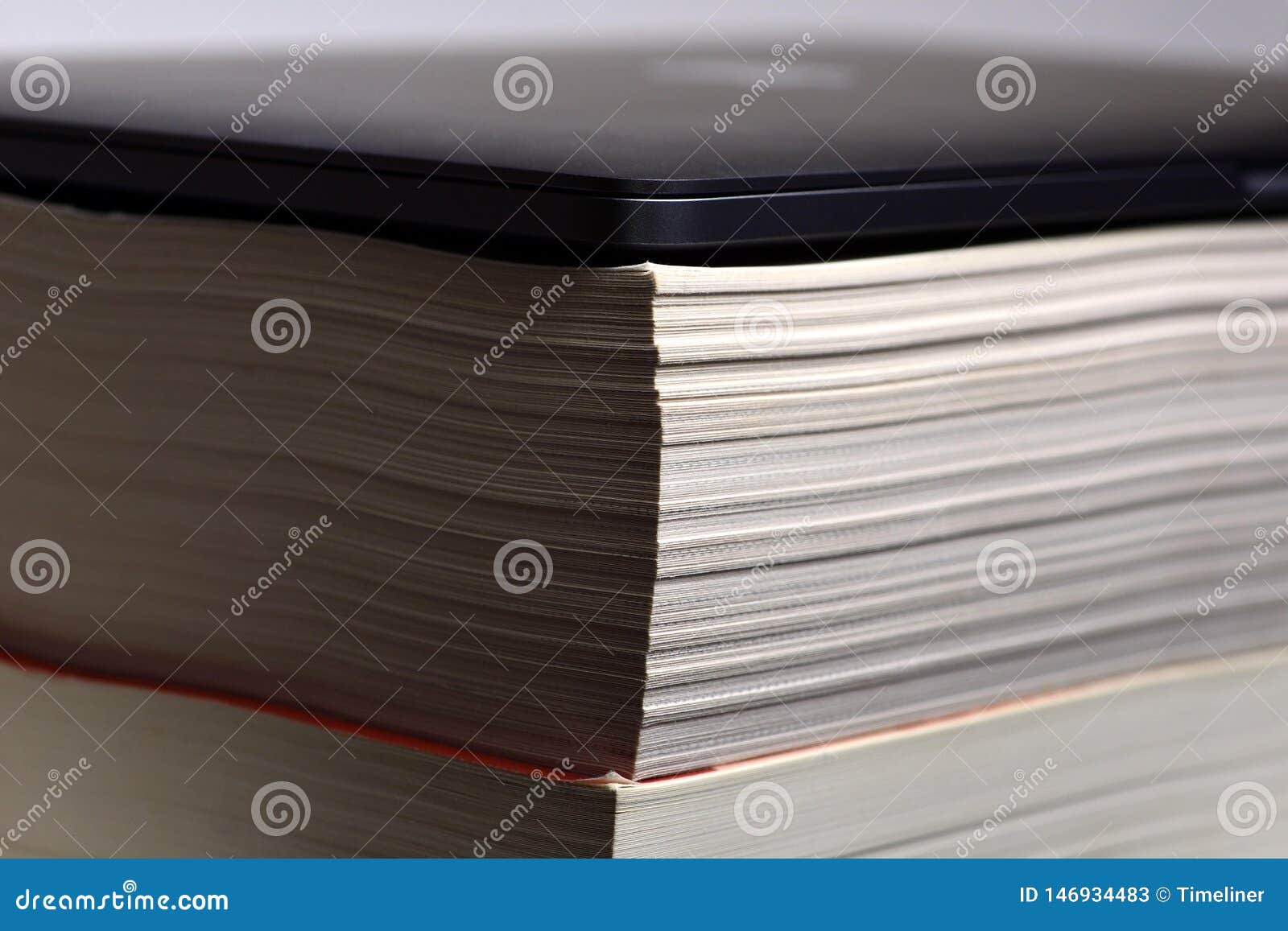 Laptop Computer Stacked upon Thick Soft Cover Book Stock Image - Image ...