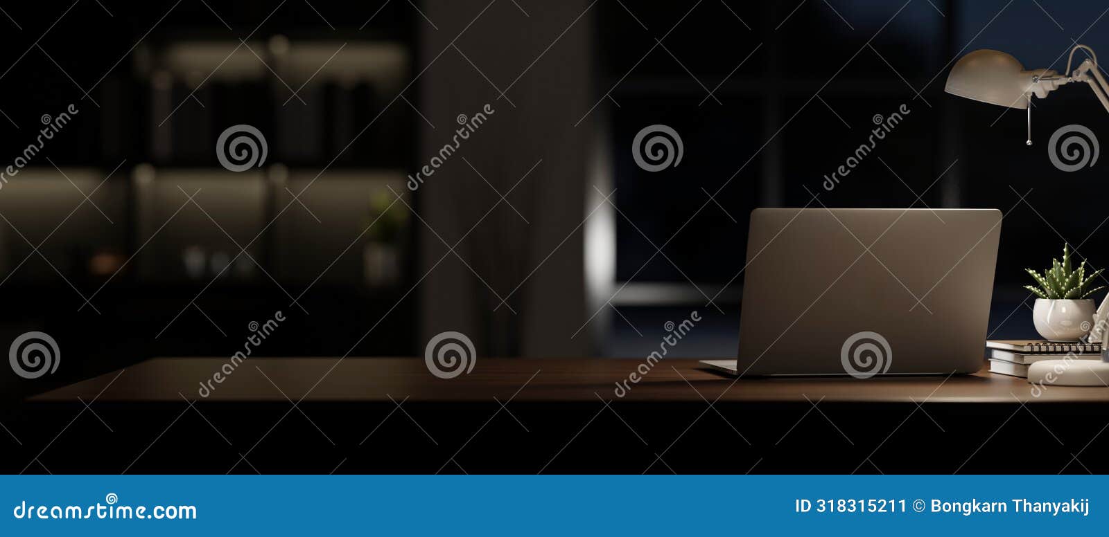 A Laptop Computer on a Table in a Modern Dark Room at Night with a Dim ...
