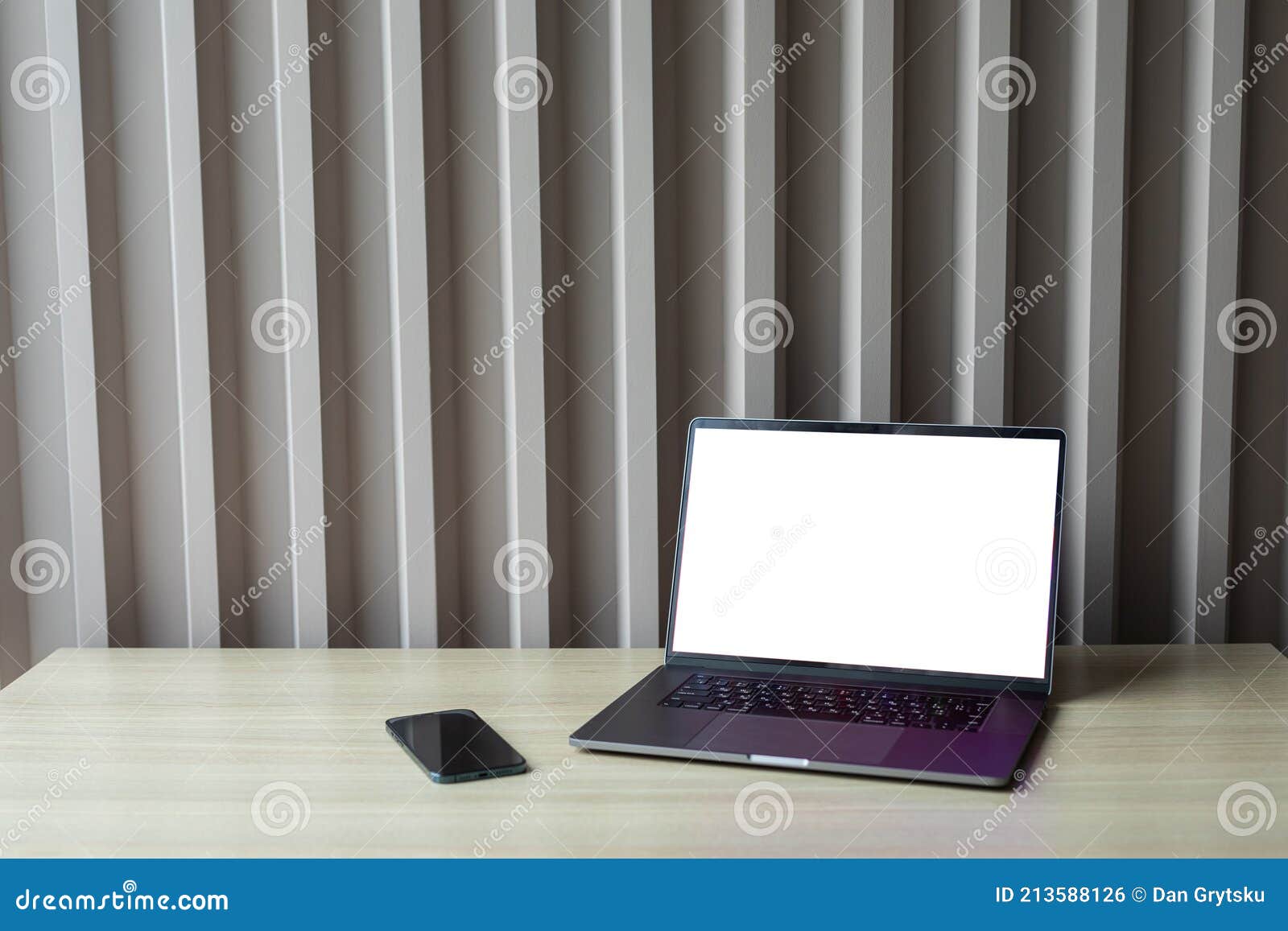 Laptop Computer White Blank Screen and Phone on Work Table. Front View ...