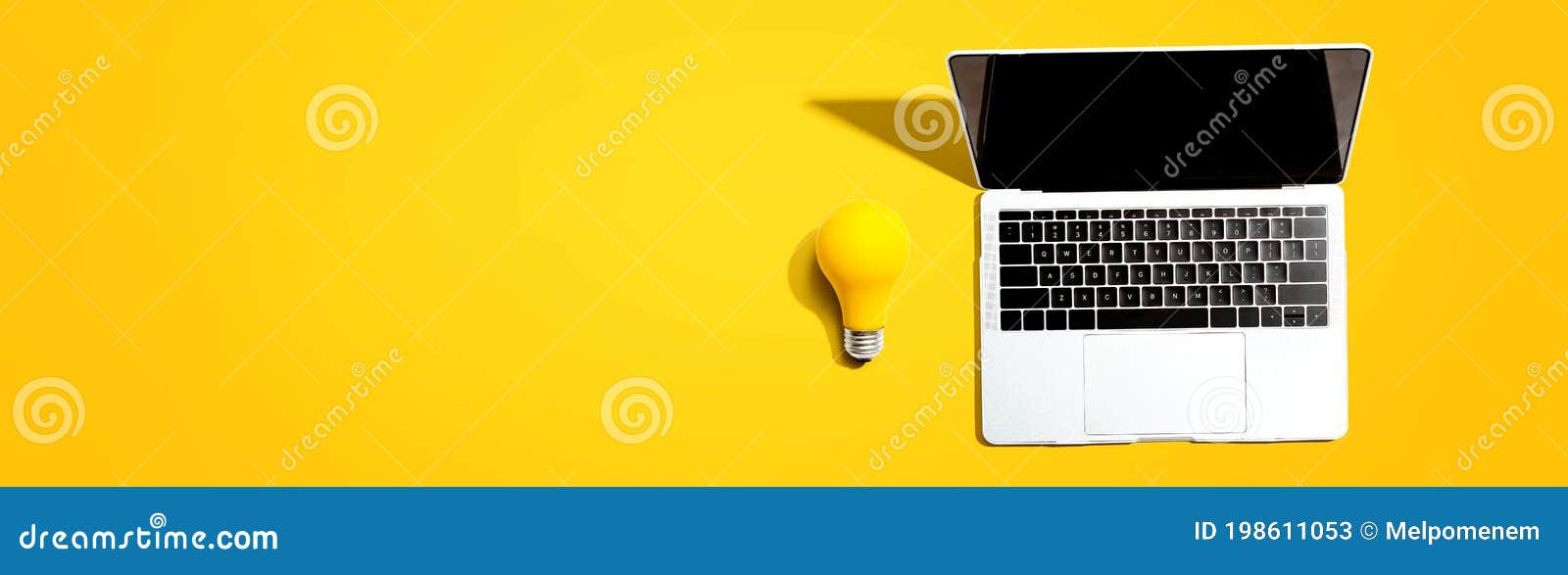 Laptop Computer with a Yellow Light Bulb Stock Image - Image of ...