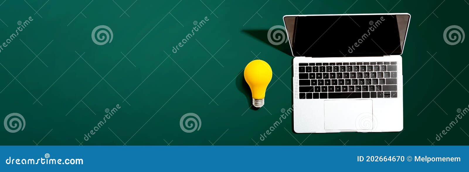 Laptop Computer with a Yellow Light Bulb Stock Photo - Image of ...
