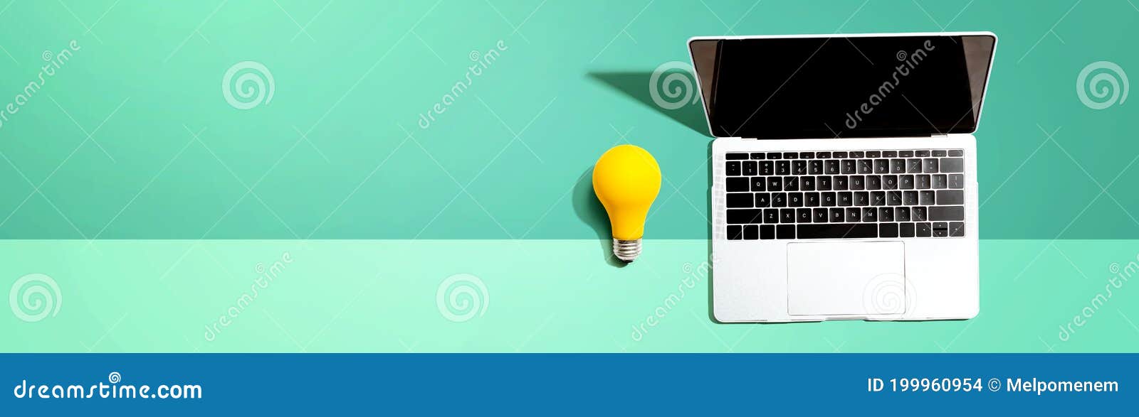 Laptop Computer with a Yellow Light Bulb Stock Photo - Image of ...