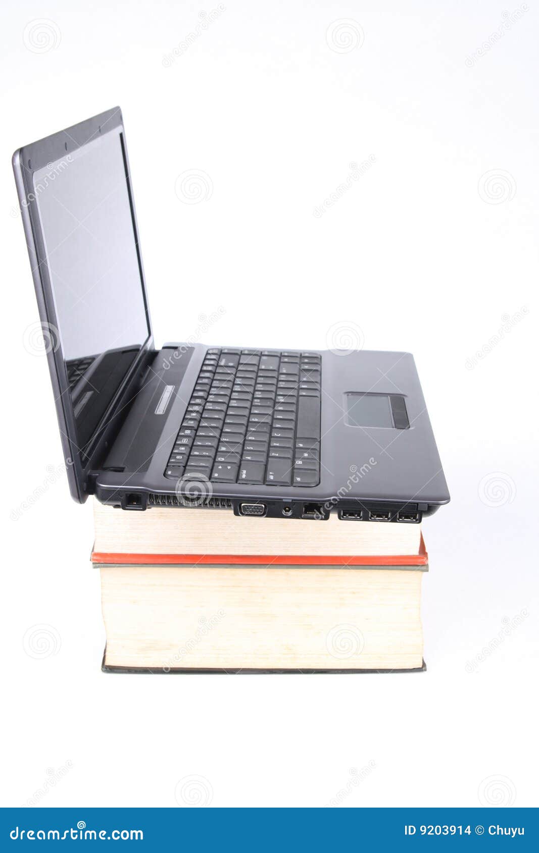 A Laptop Computers on Thick of Books Stock Photo - Image of laptop ...