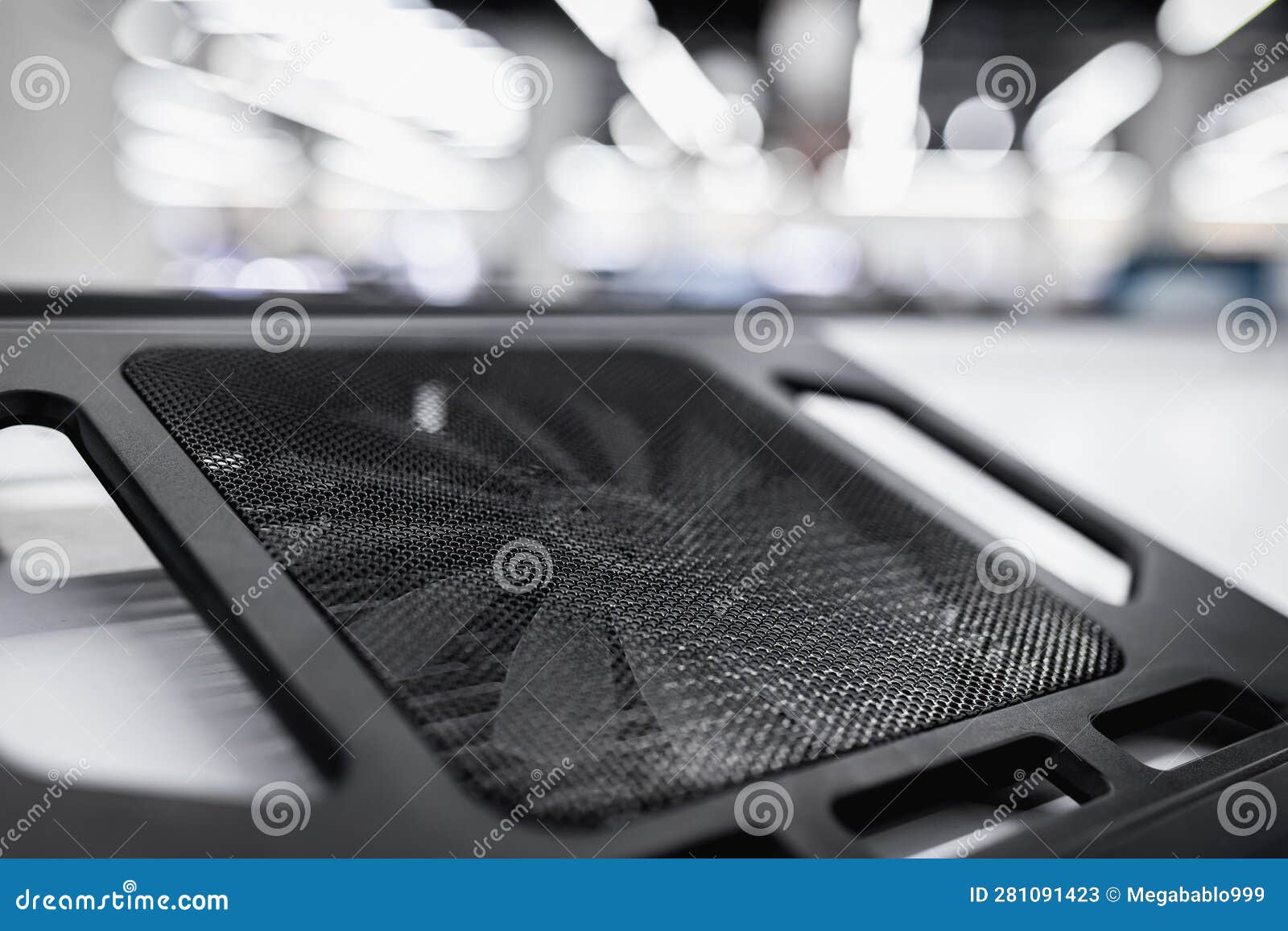Laptop Cooling Pad or Stand with a Fan is Sold on a Shelf in an ...