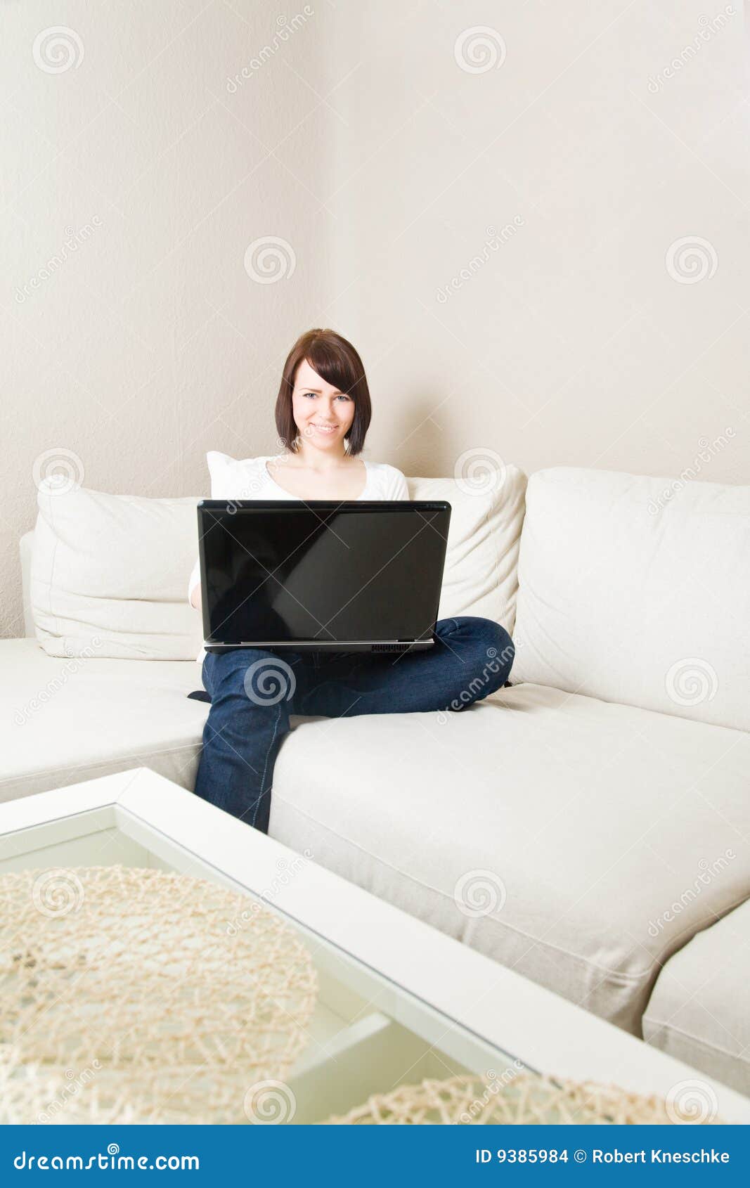 With laptop on a couch stock photo. Image of laugh, living - 9385984