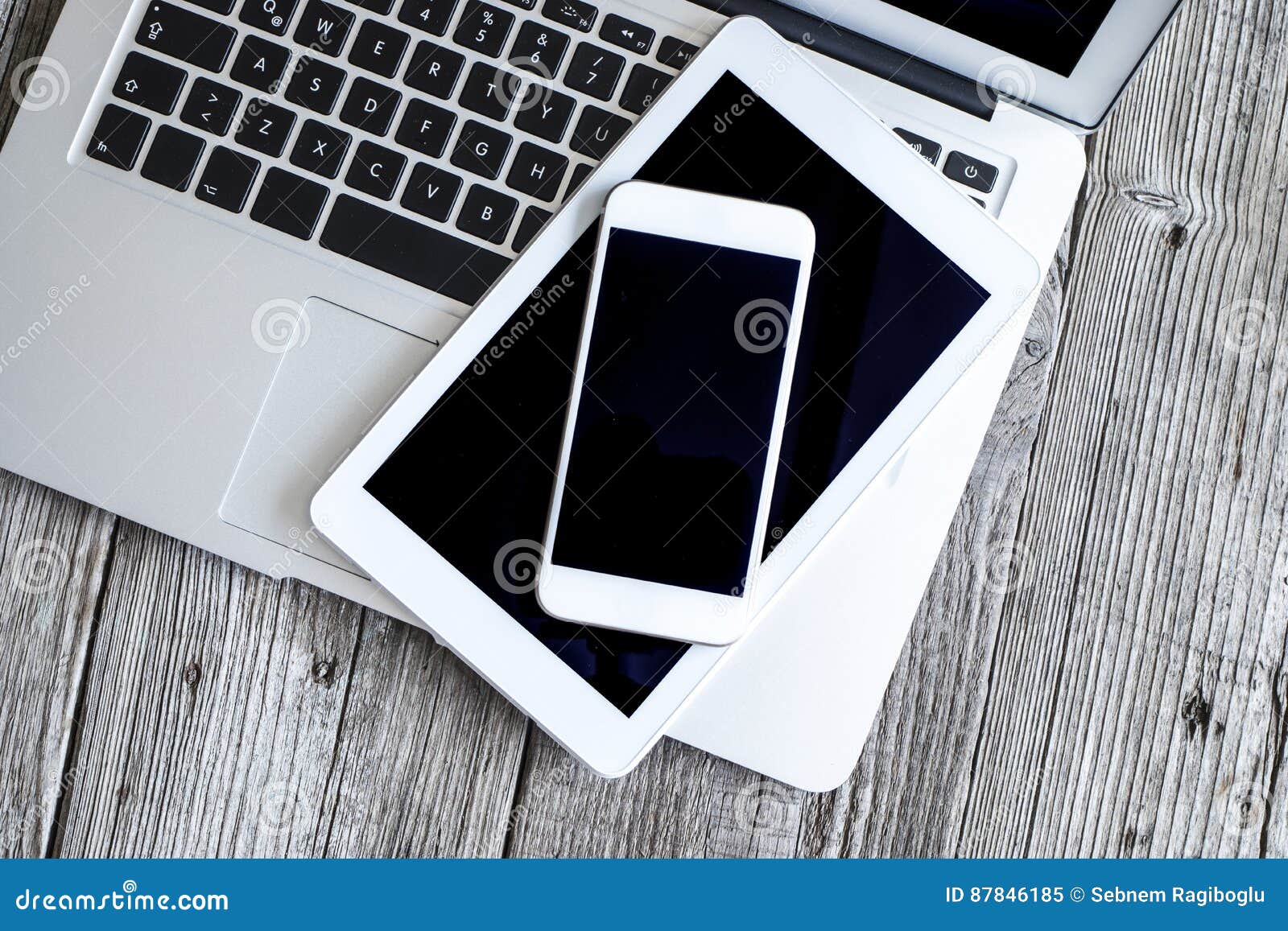 Laptop with Digital Tablet and Mobile Phone on Wooden Table Stock Image ...