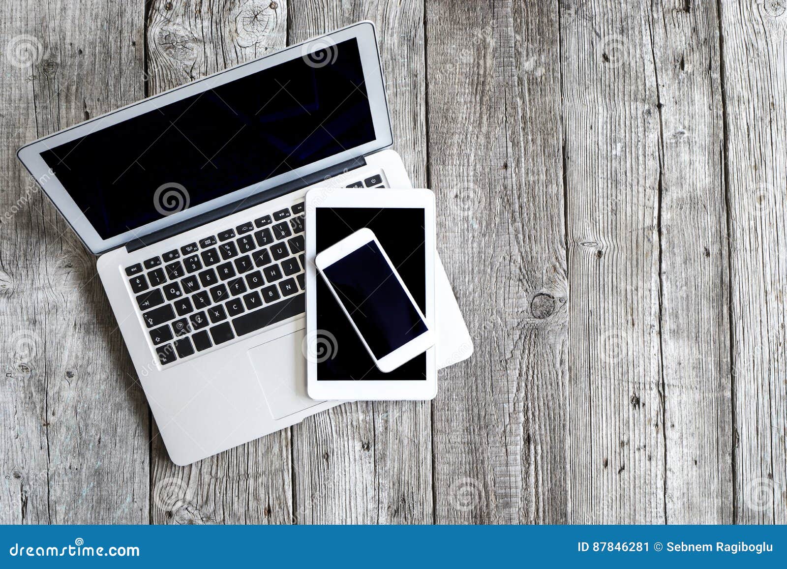 Laptop with Digital Tablet and Mobile Phone on Wooden Table Stock Image ...