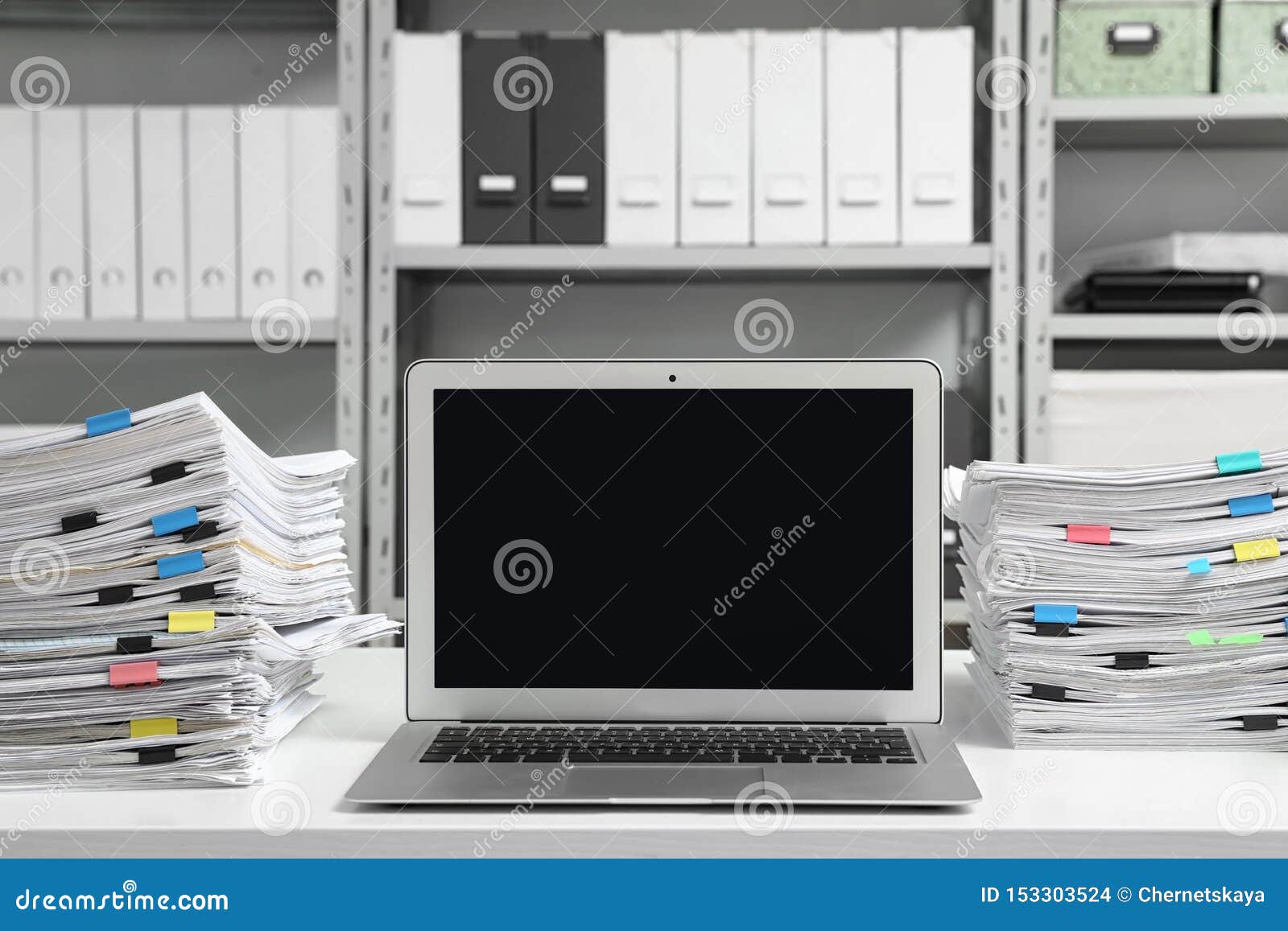Laptop and Documents on Desk in Office Stock Photo - Image of ...