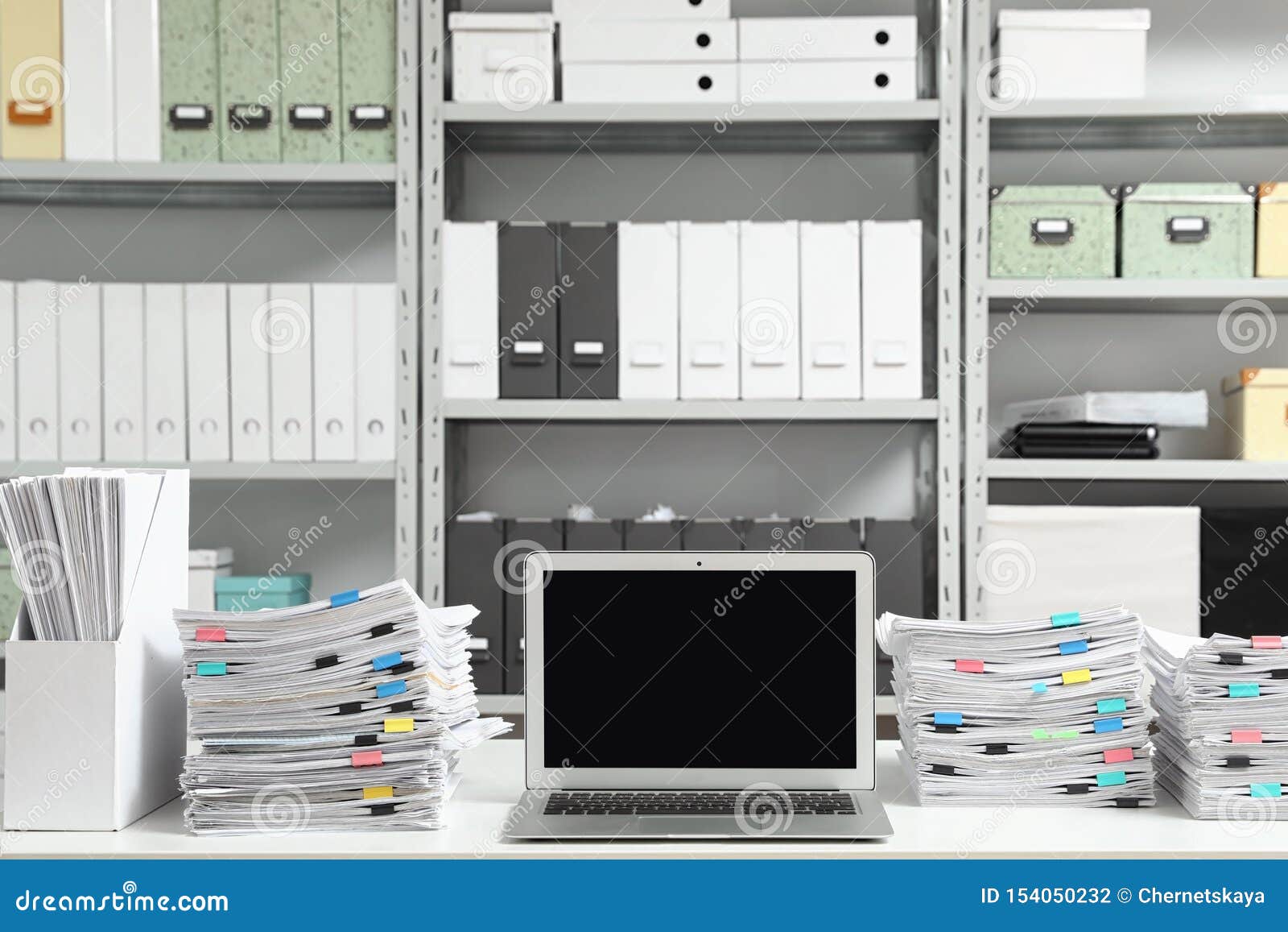 Laptop and Documents on Desk in Office Stock Photo - Image of business ...