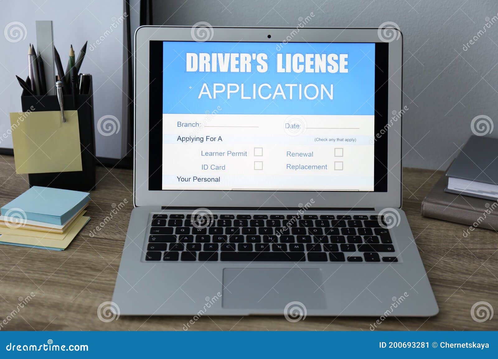 Laptop with Driver`s License Application Form on Table in Office Stock ...
