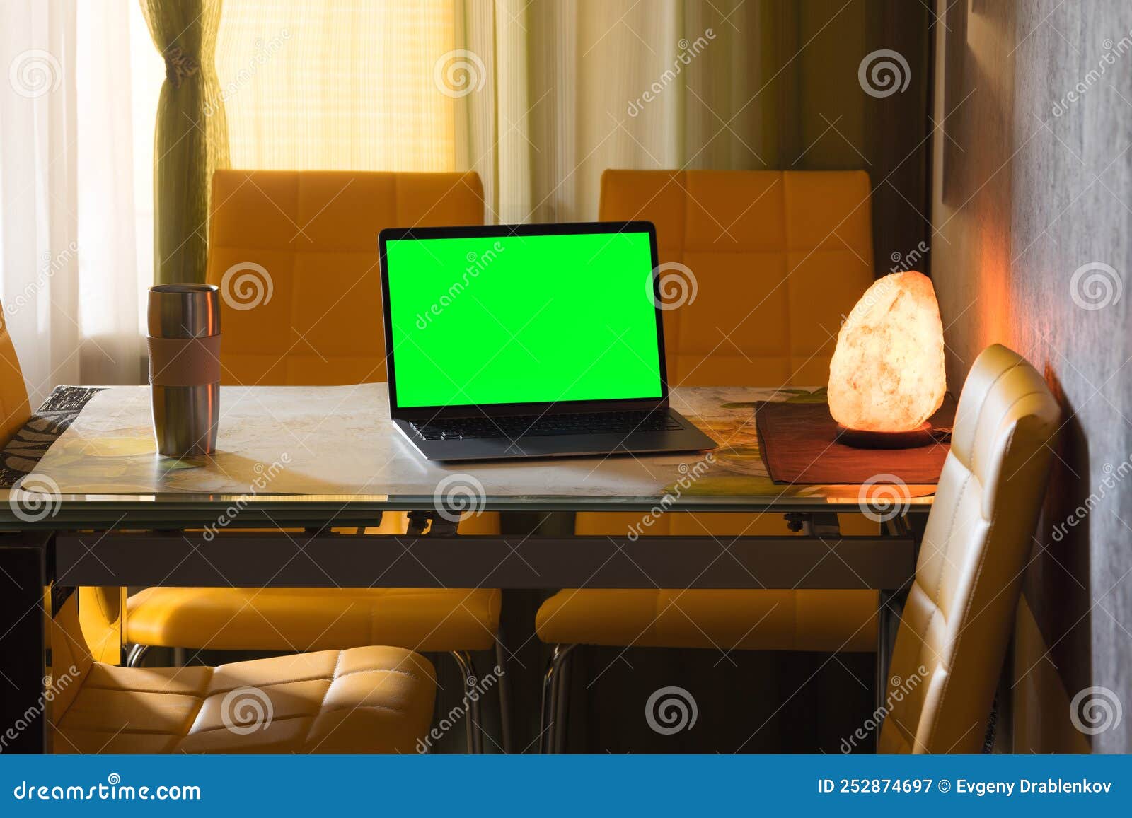 A Laptop With An Empty Green Screen On The Desk In Cozy Home Interior ...