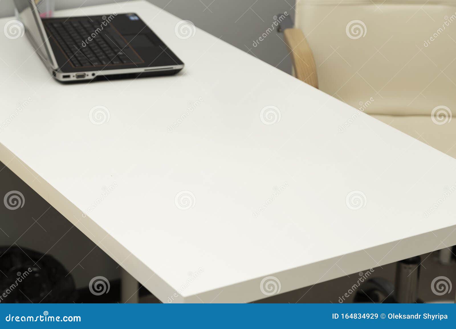 Laptop on an empty table stock image. Image of notebook - 164834929