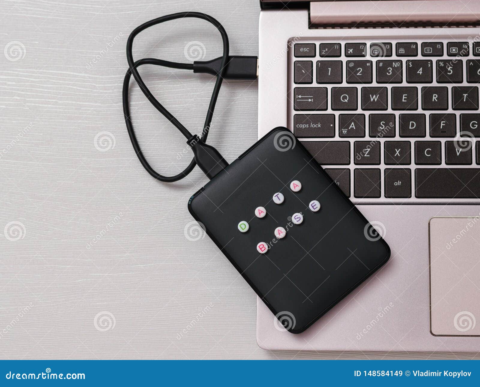 Laptop with External Hard Drive Labeled Database on the Table. Flat Lay ...