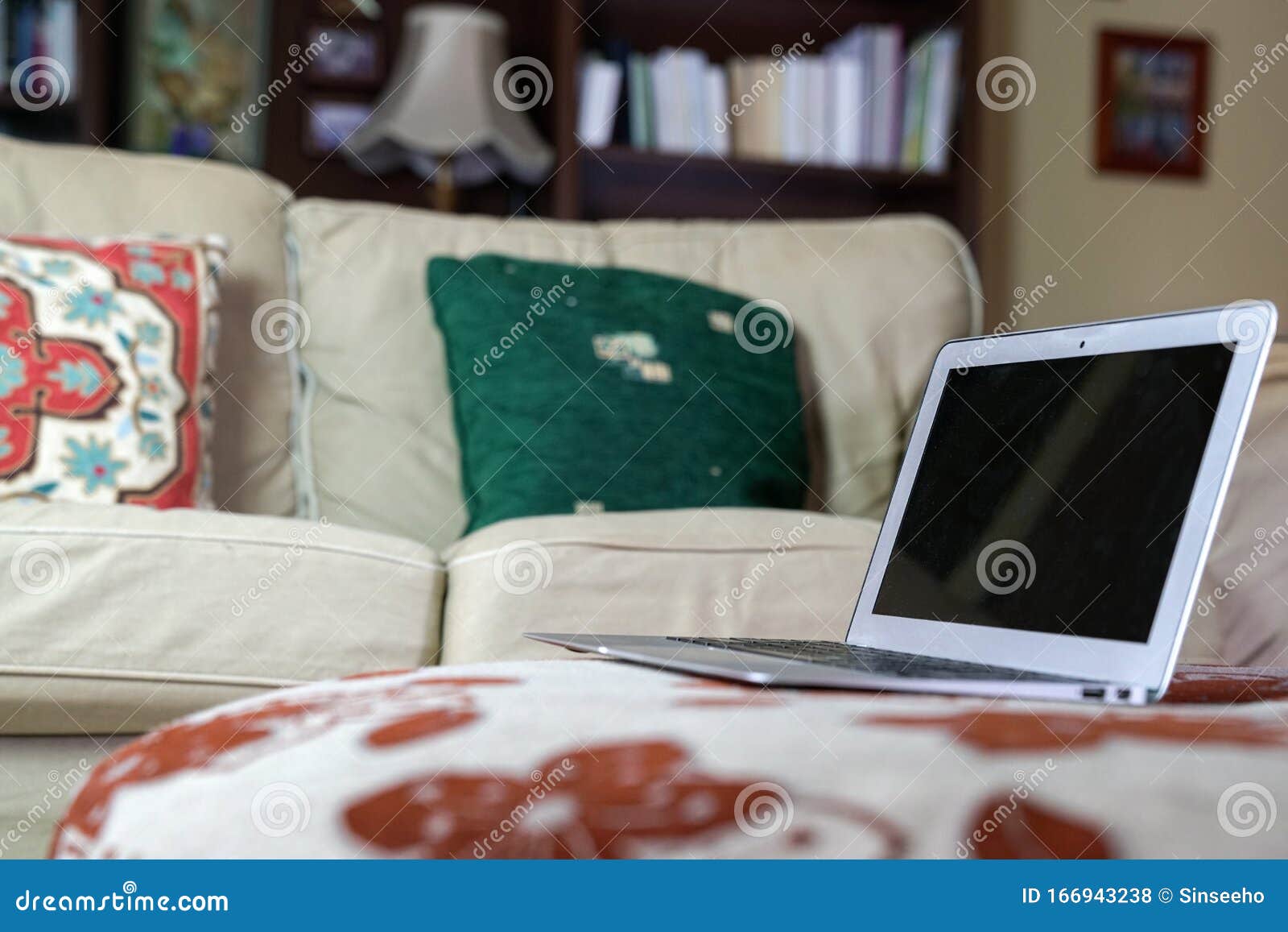 Laptop on a Fabric Top with Couch on Sight, a Home Environment. Work ...