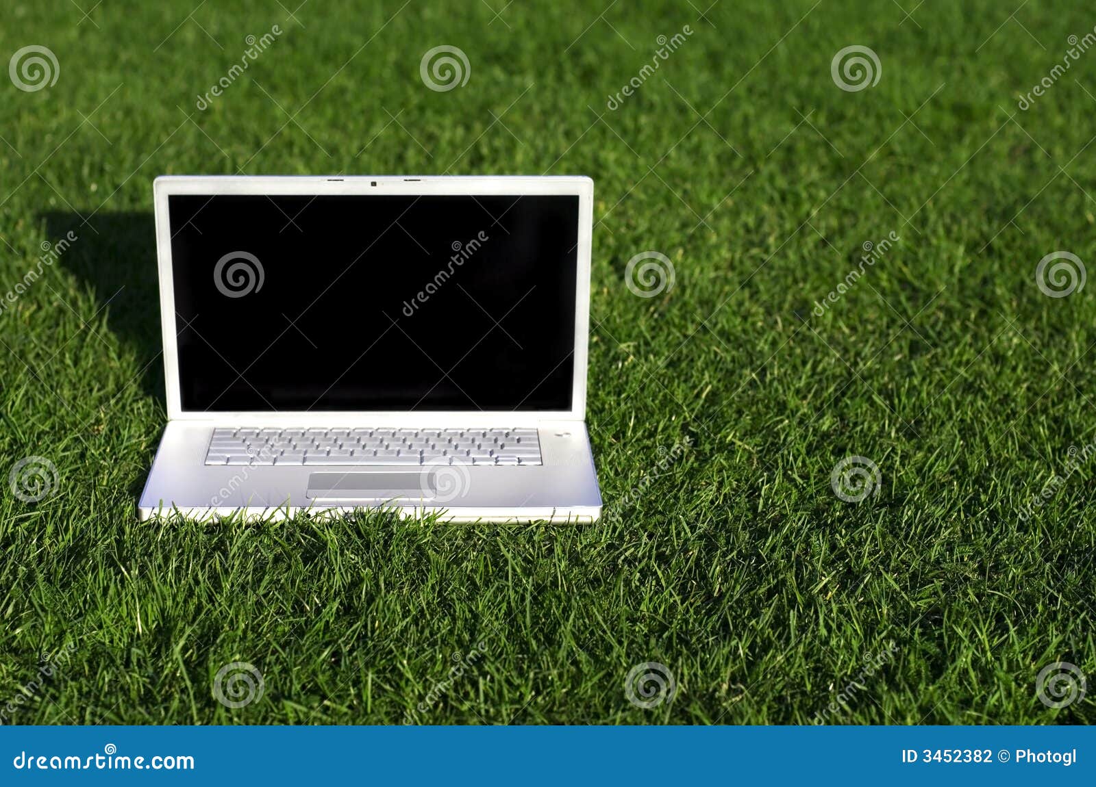 Laptop on grass stock photo. Image of connection, effect - 3452382
