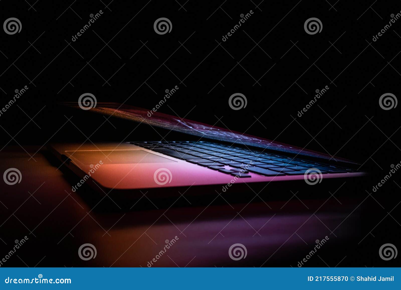 Laptop Half Closed from the Side in the Dark Stock Photo - Image of ...