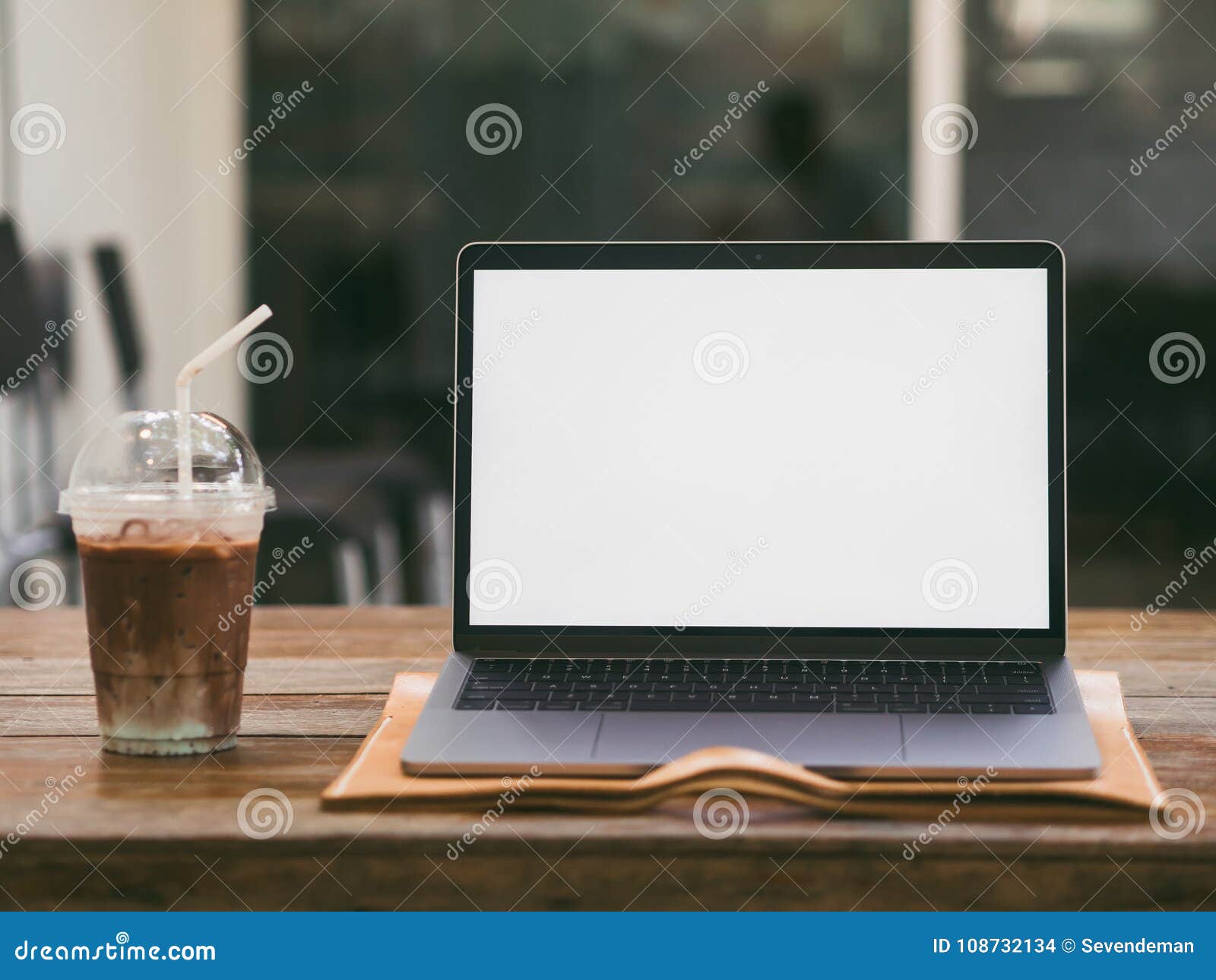 Laptop and Iced Coffee in the Cafe. Concept of Freelance Working Stock ...