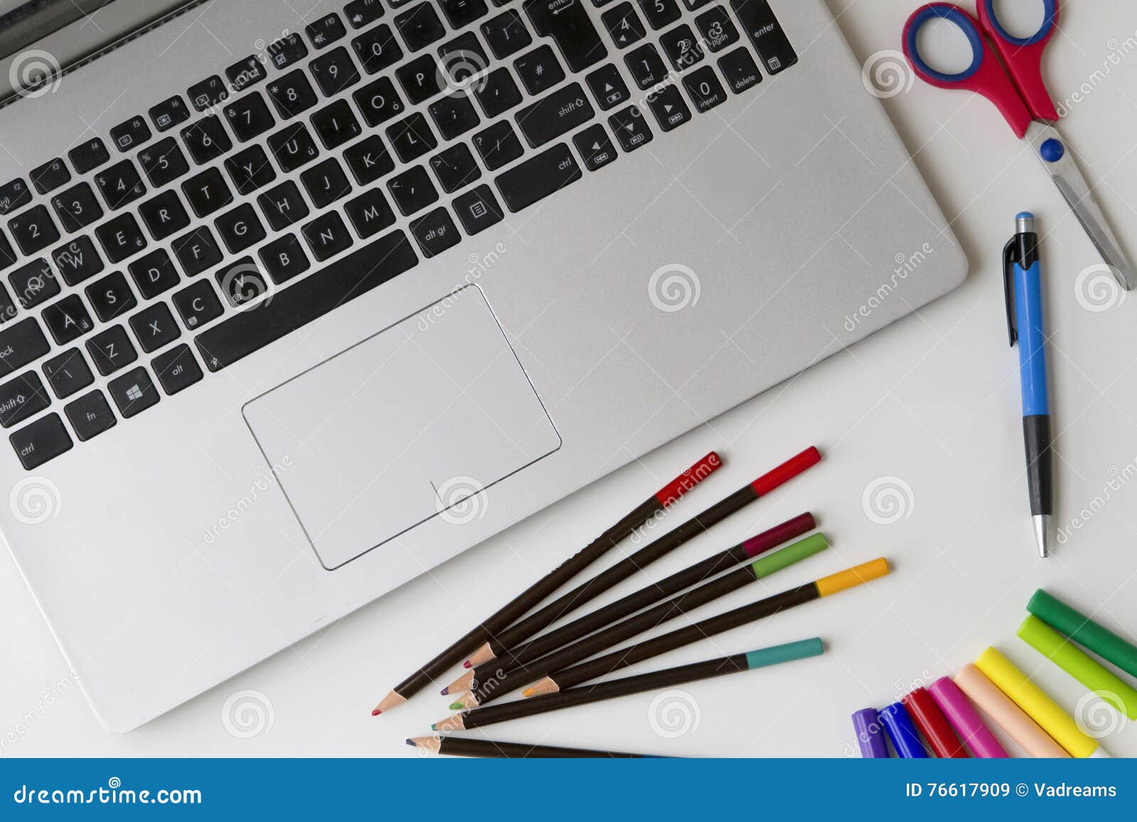Laptop Keyboard and Some Objects Such As Pen, Colored Pencils, Felt Tip ...