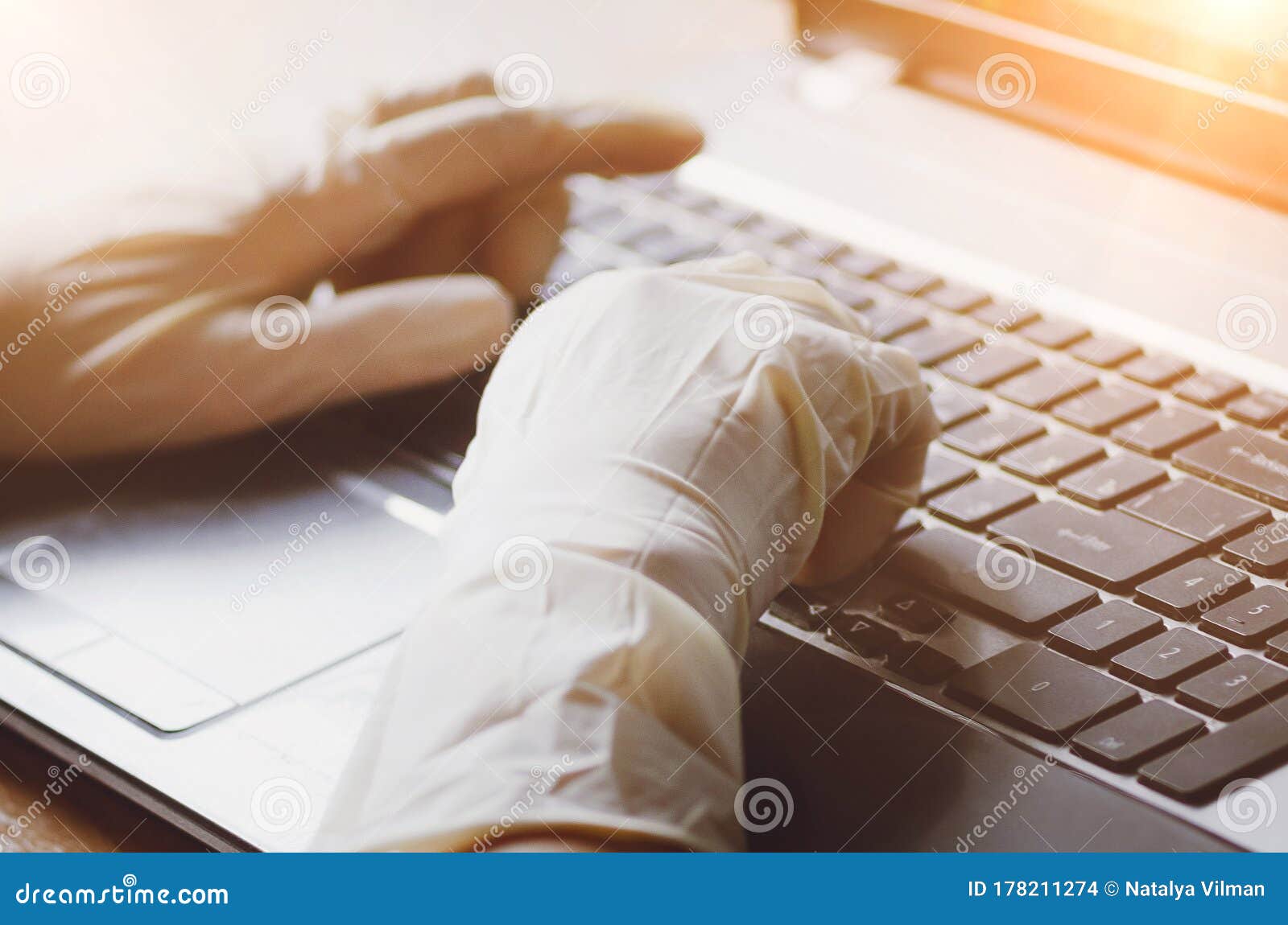 Laptop Keyboard. Work at the Computer in Gloves for Protection Against ...