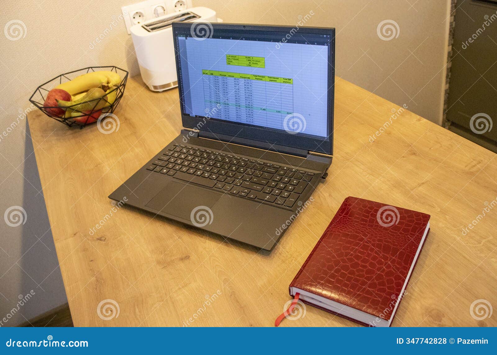 Laptop on the Kitchen Counter Top with an Excel Sheet on Computer ...