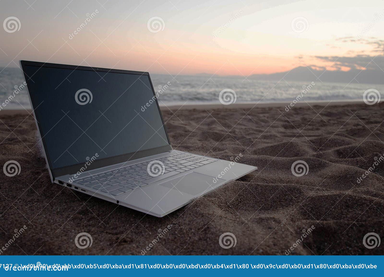 The Laptop is Lying on the Sand on the Beach. the Concept of Working ...