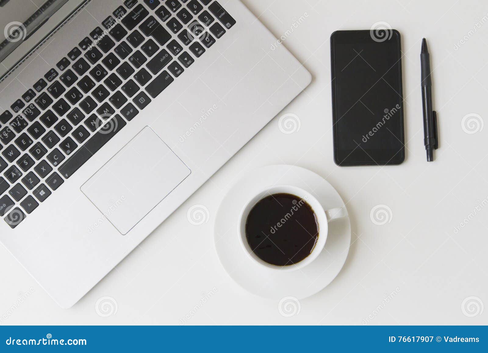 Laptop, Mobile Phone, Pen and Cup of Coffee on White Table. Top View ...