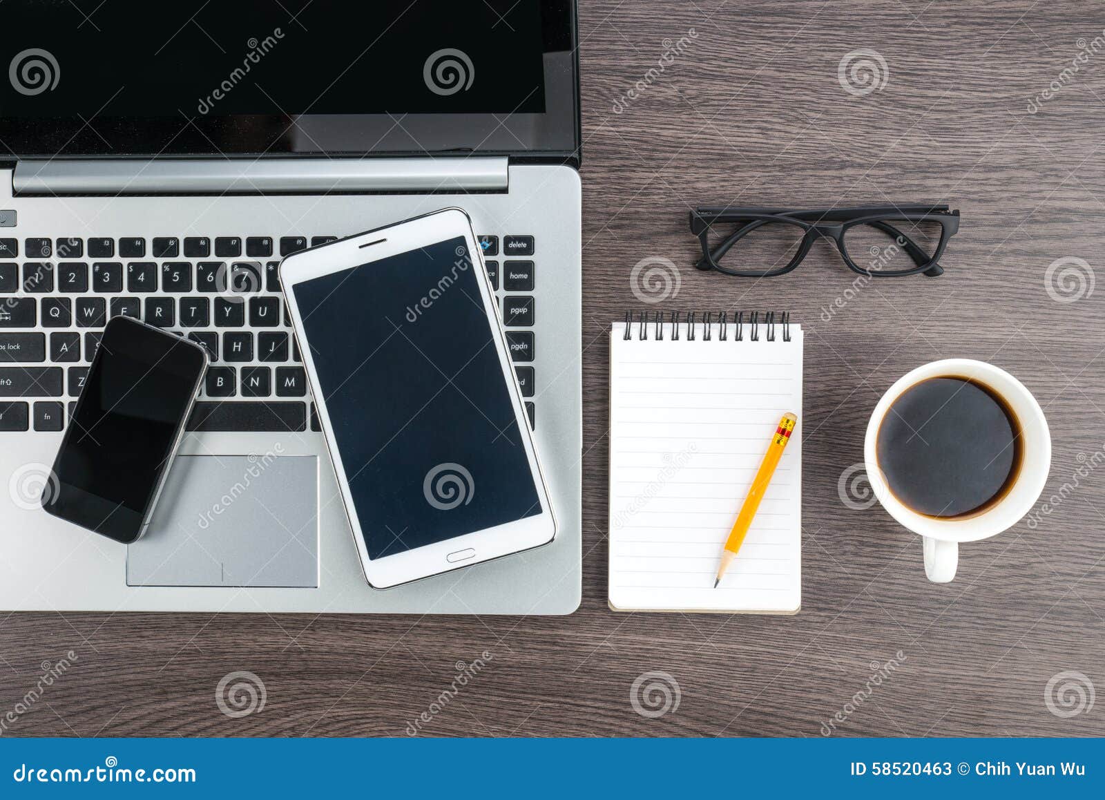 Laptop Mobile Phone and Tablet with Notebook on the Desk Stock Image ...