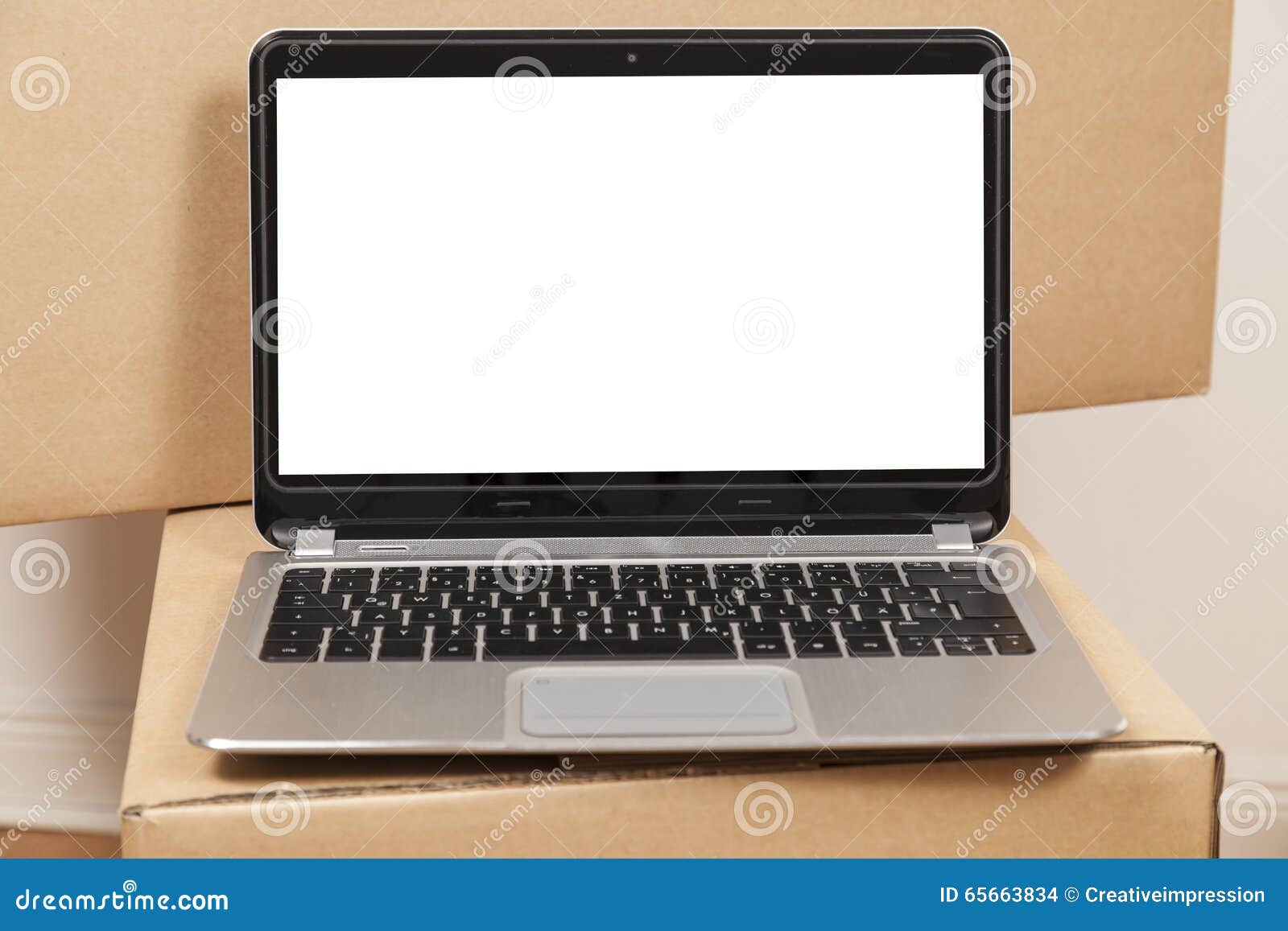 Laptop and moving box stock photo. Image of move, internet - 65663834