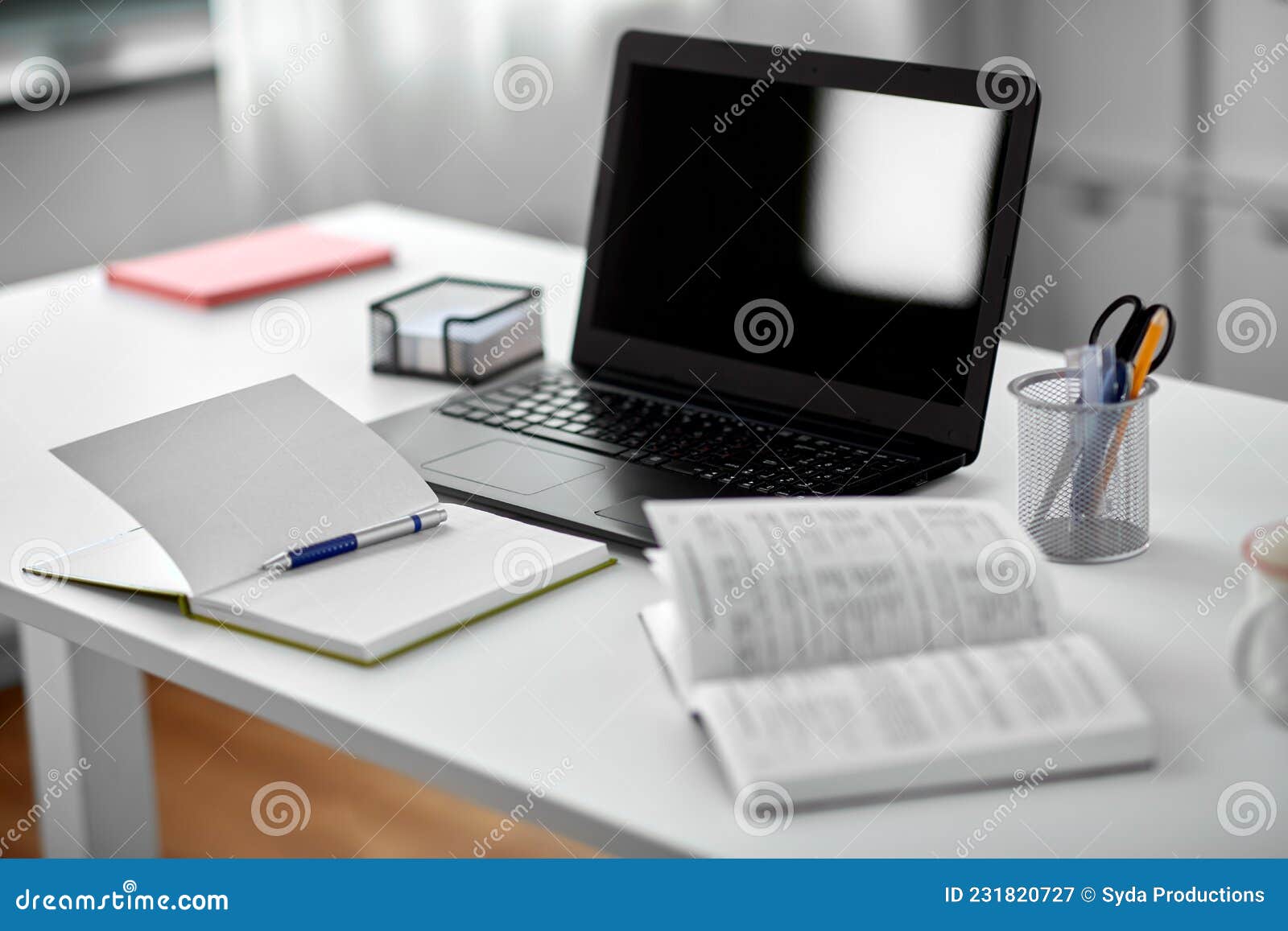 Laptop, Notebook and Book on Table at Home Office Stock Image - Image ...