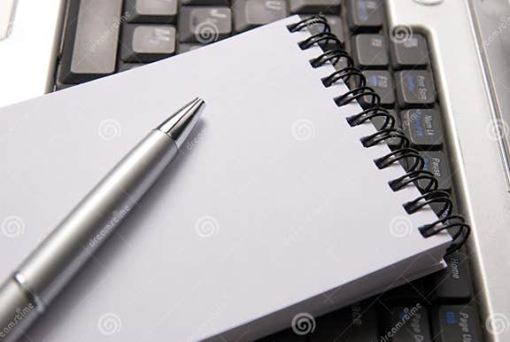 Laptop, notebook and a pen stock photo. Image of idea - 6021418